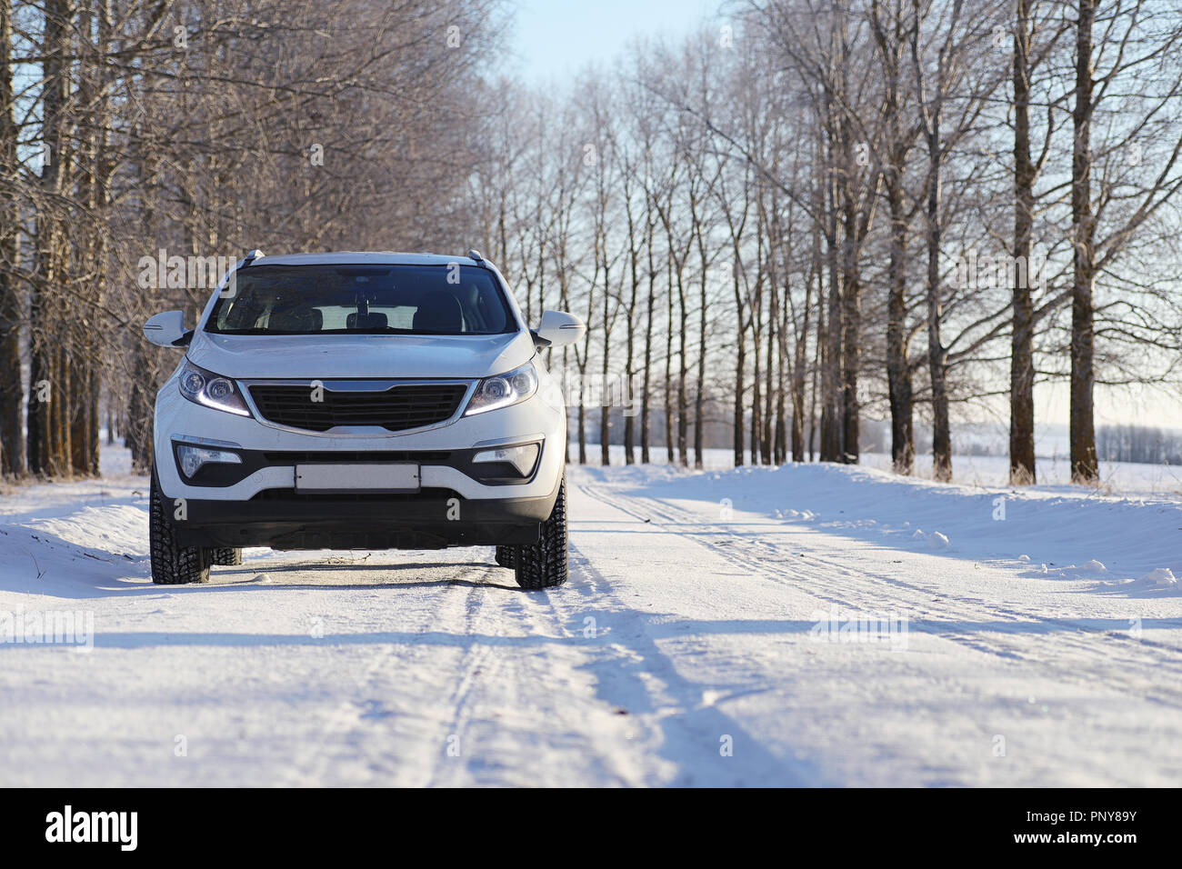 Winter road and a car Stock Photo - Alamy