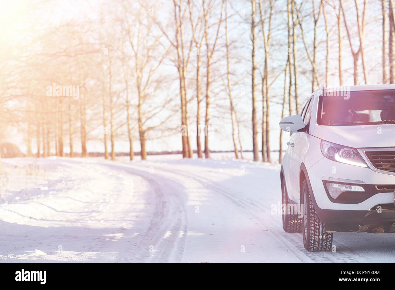 Winter road and a car Stock Photo - Alamy