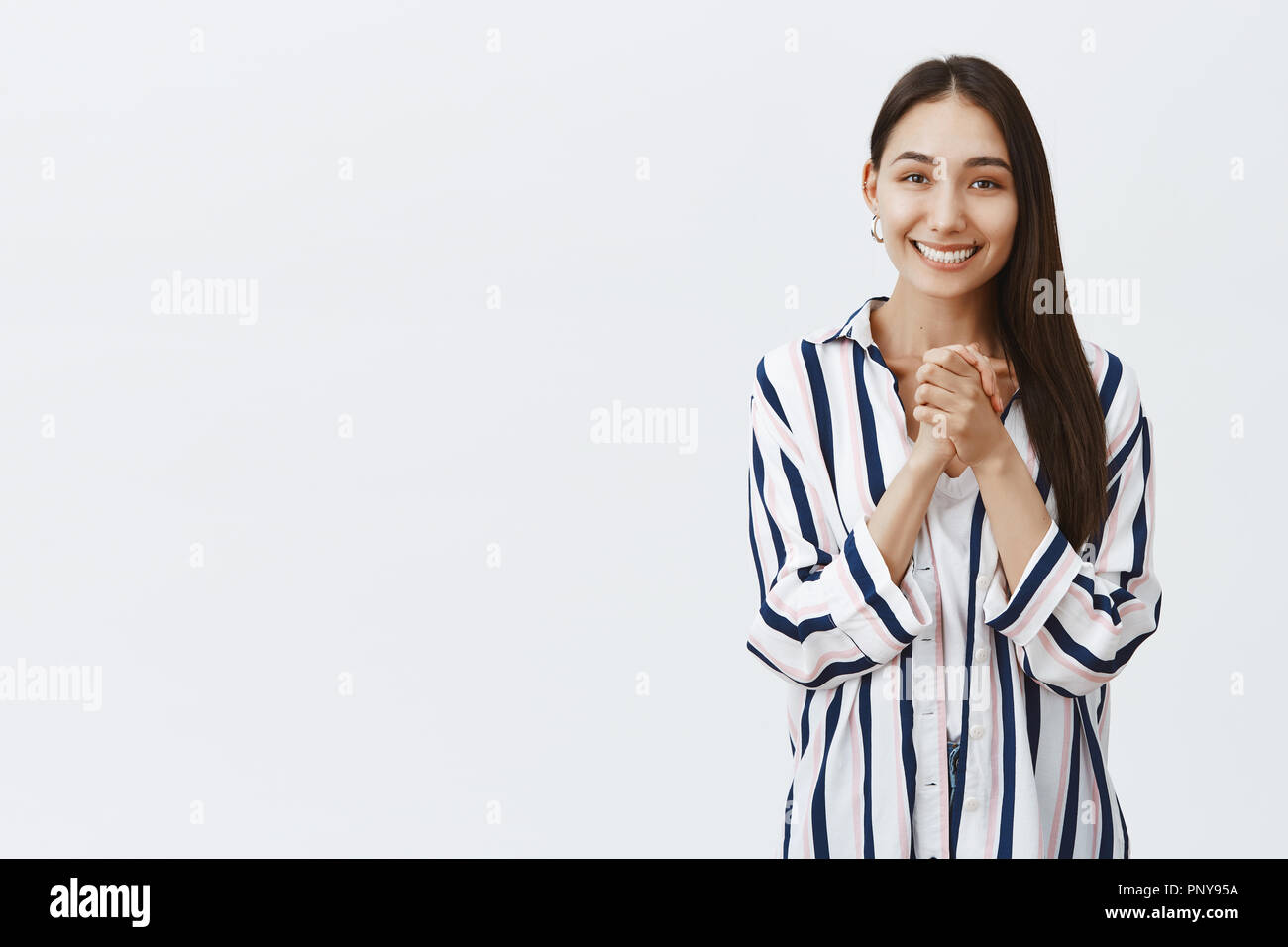 Girl looking with caring and admirable eyes at camera, being thrilled ...