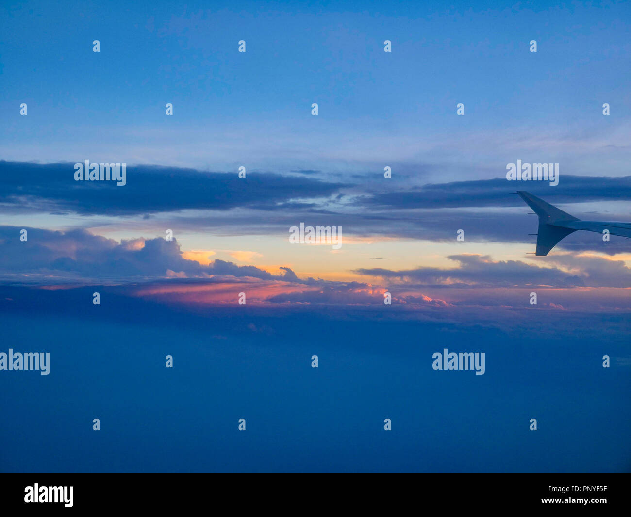 Clouds at sunset, distant storm on approach to O'Hare International ...