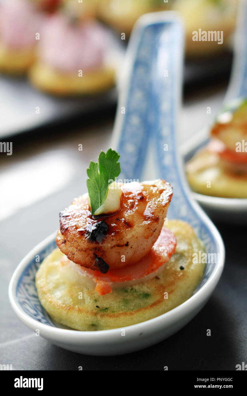 gourmet scallop canapes on spoon Stock Photo - Alamy