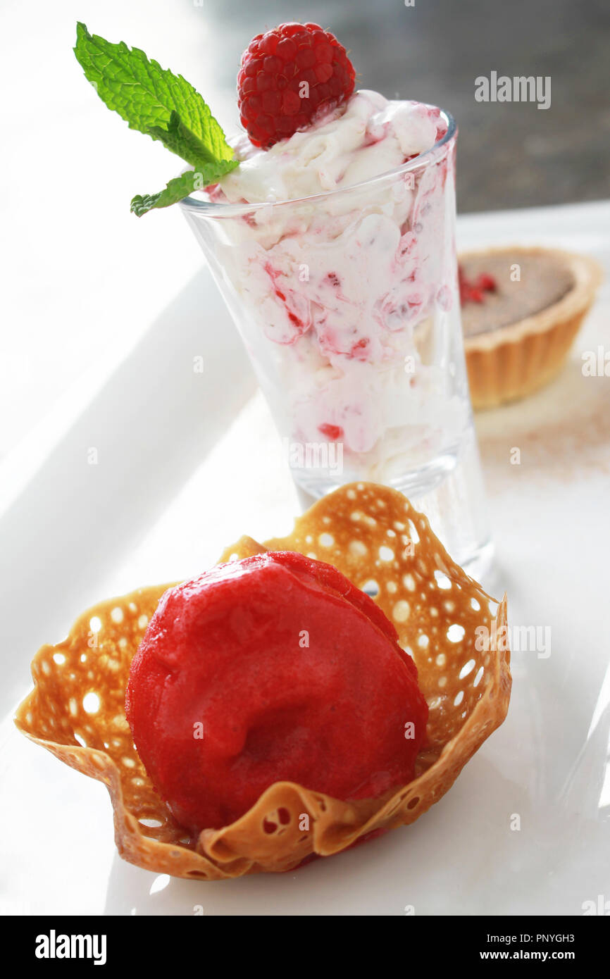 plated eaton mess dessert with raspberries Stock Photo - Alamy