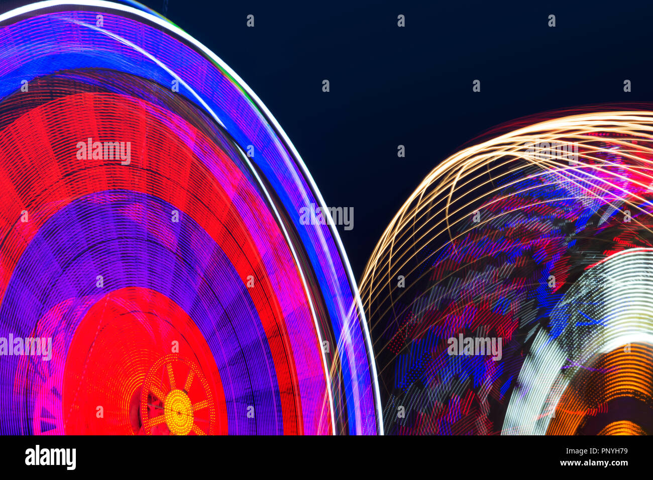 Amusement park long exposure photo Stock Photo - Alamy