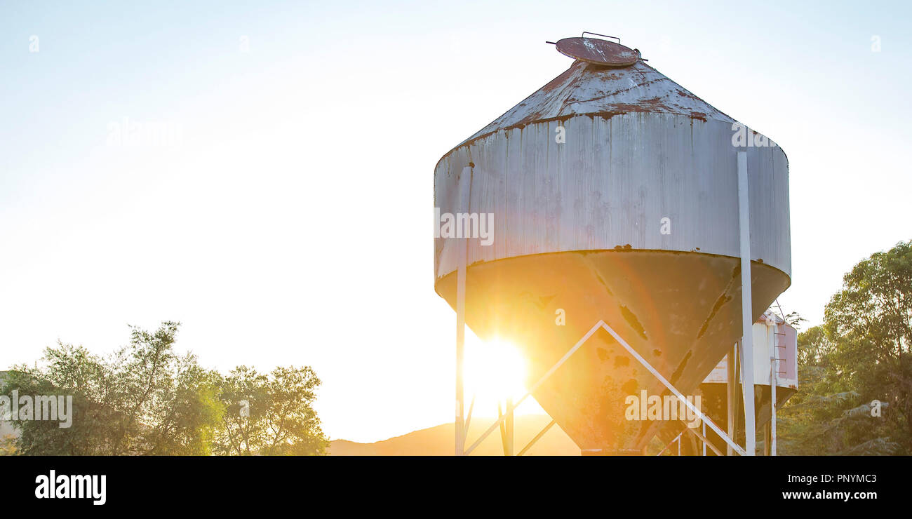 Deserted tank with view of mountain top and sunset Stock Photo - Alamy