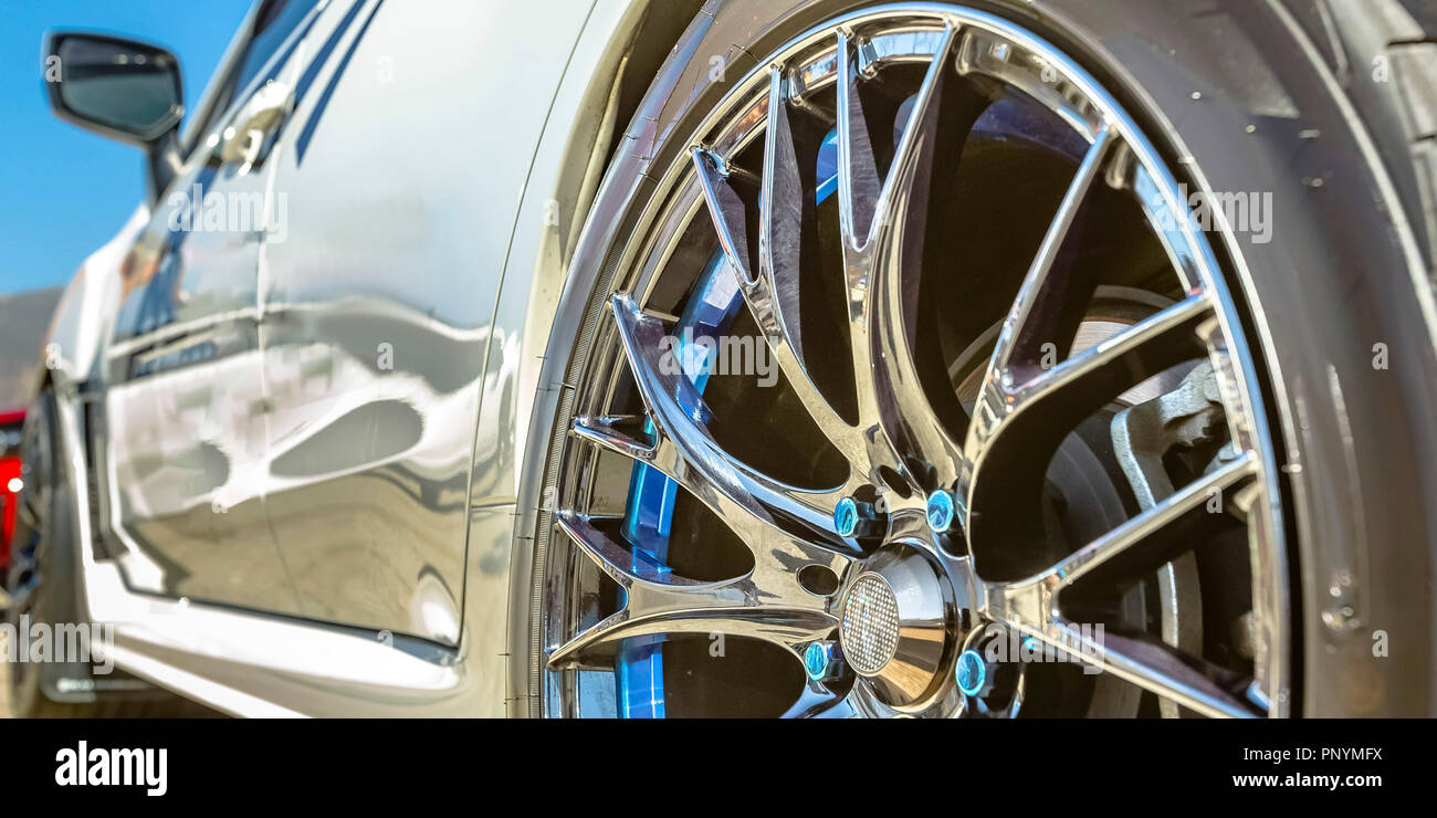 Exterior of a white car with silver tire rim Stock Photo - Alamy