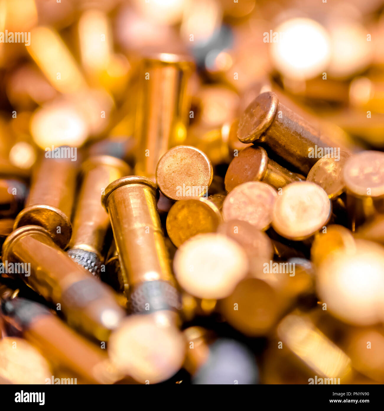 Numerous golden bullets heaped together Stock Photo - Alamy