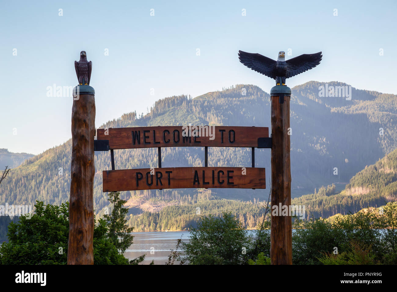 Welcome sign to Port Alice during a vibrant sunny summer day. Located ...
