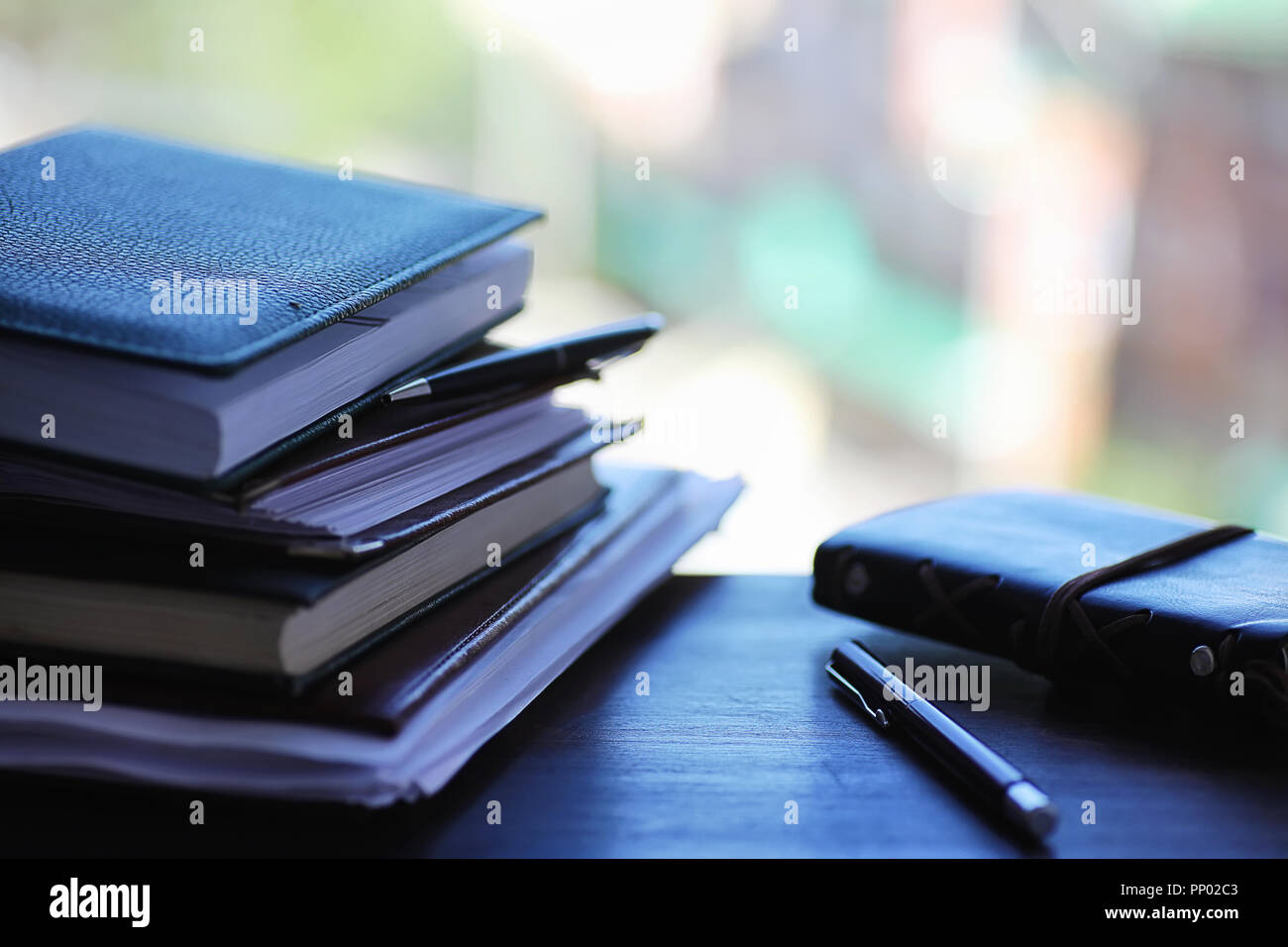A stack of textbooks on the windowsill Stock Photo - Alamy