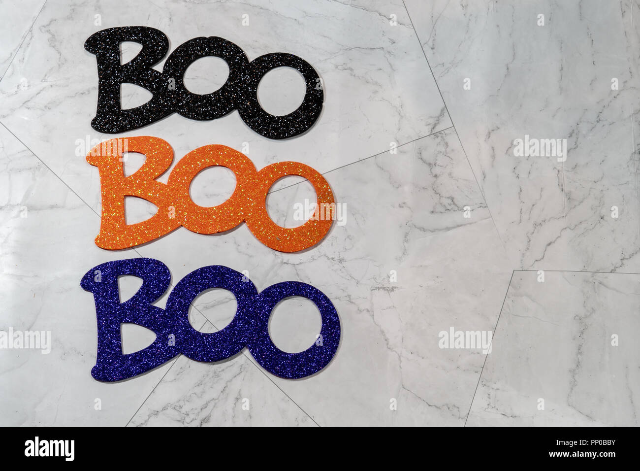 Boo word for Halloween three times, centered, isolated on marble ...
