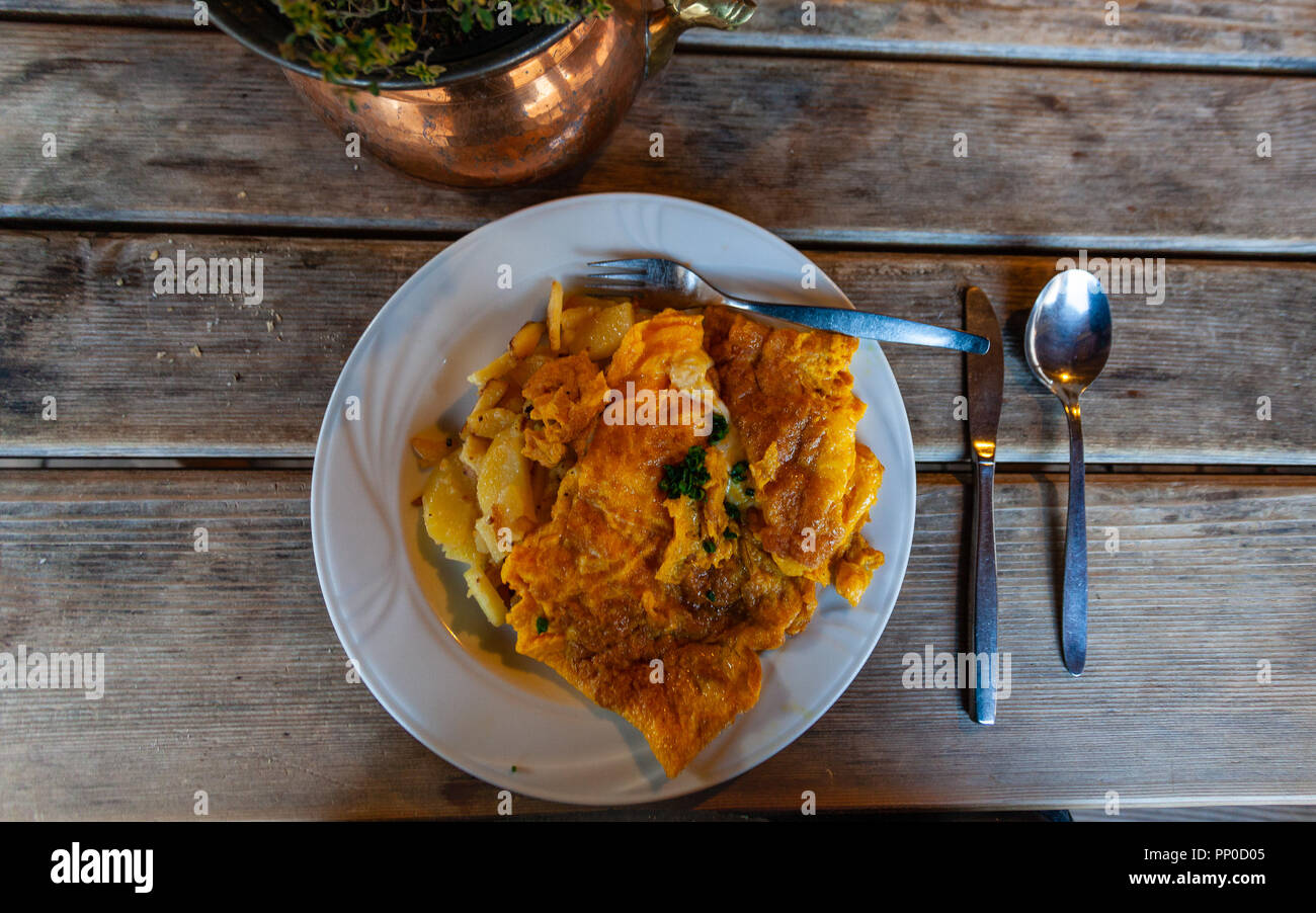Traditional south tyrolean dish with omelette and potatoes Stock Photo ...