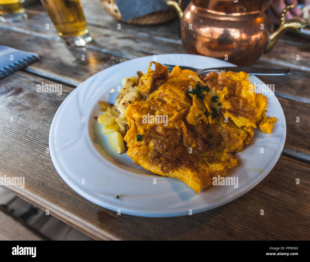 Traditional south tyrolean dish with omelette and potatoes Stock Photo ...