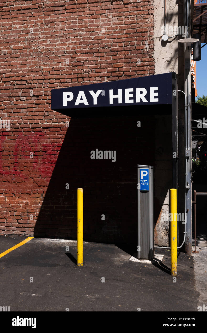 "Pay Here" sign at public parking lot, in downtown Los Angeles ...