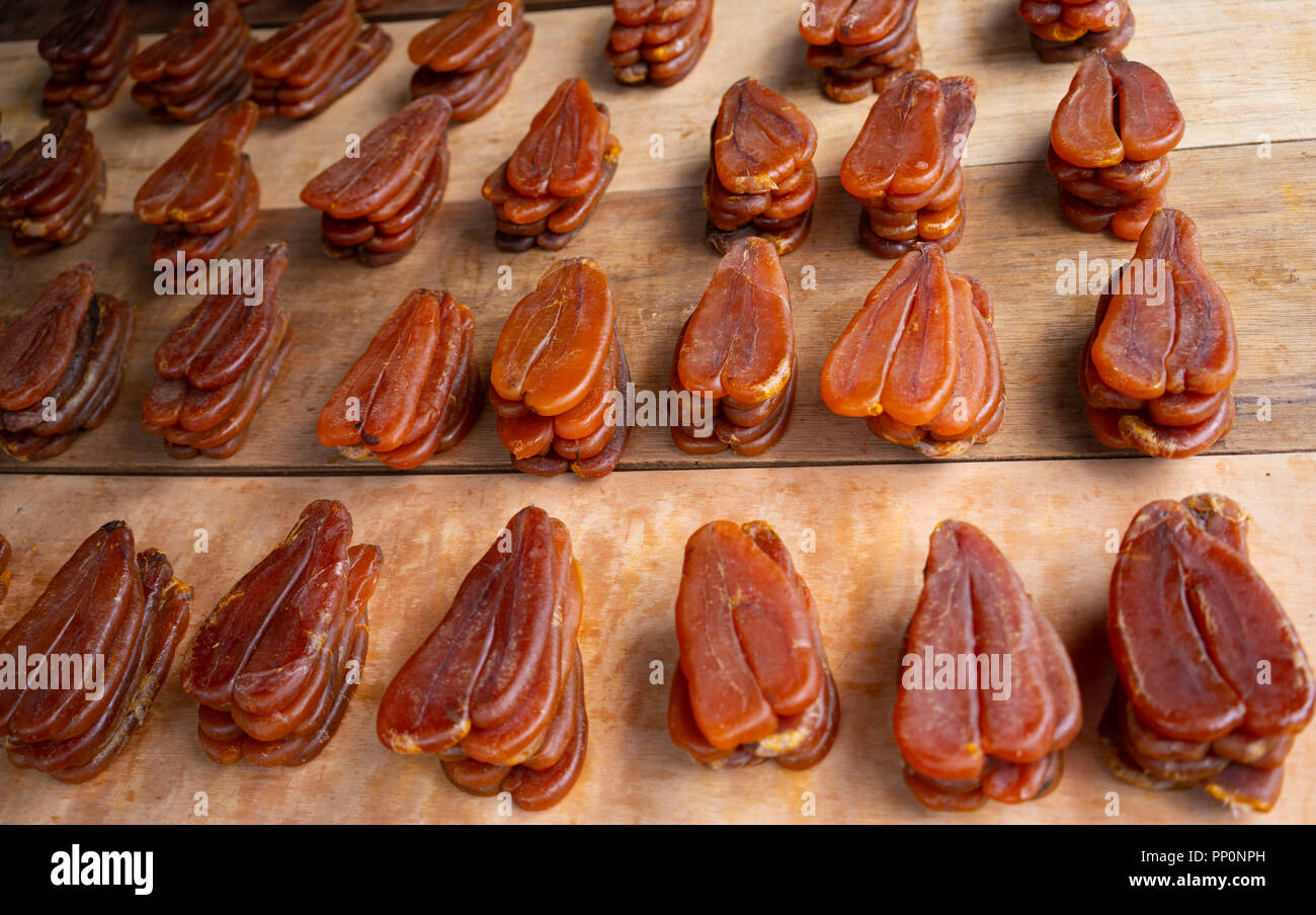 Karasumi mullet roe drying outside on a market stand in Taiwan Stock ...