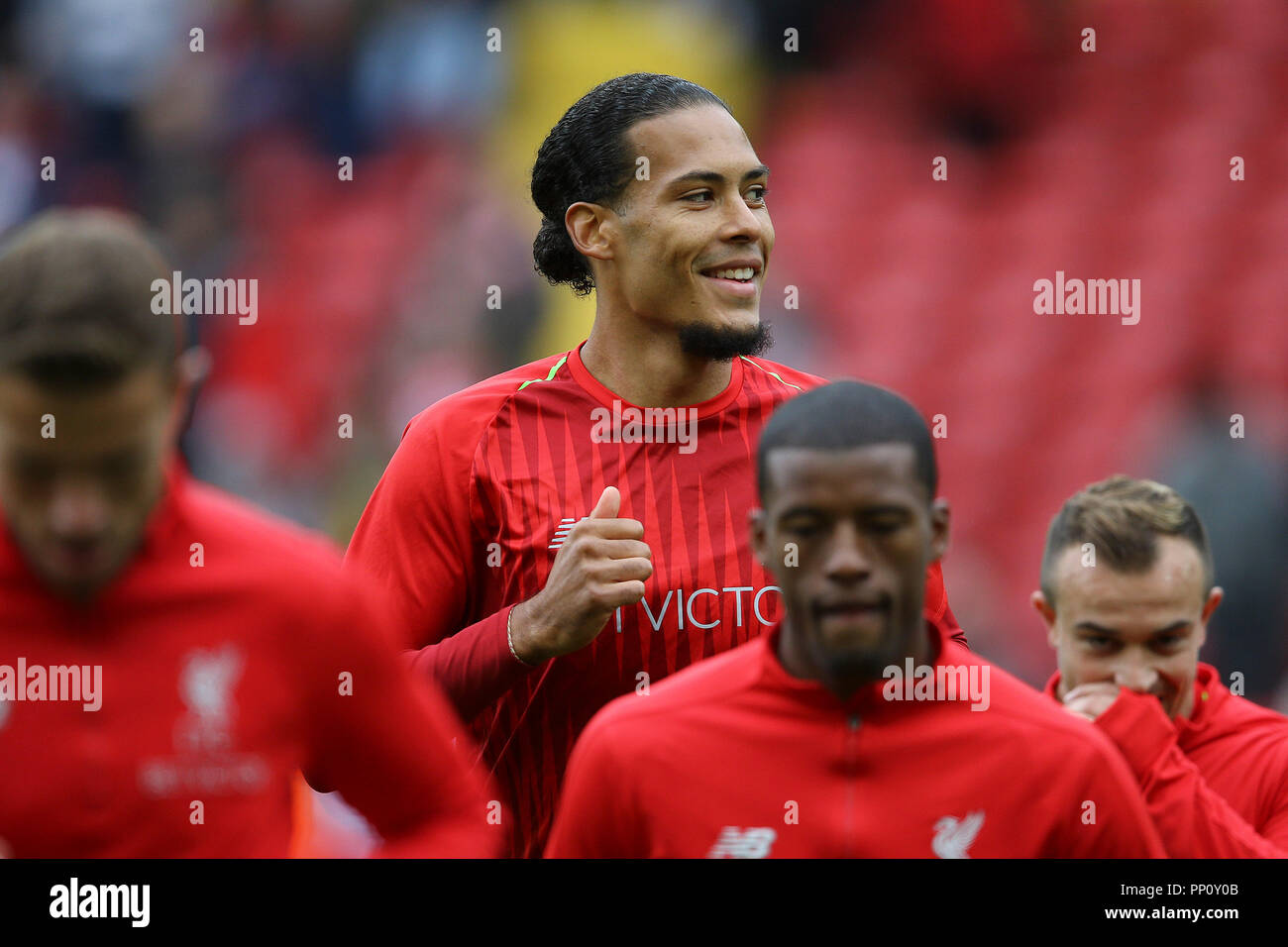 Liverpool, UK. 22nd Sep, 2018. Virgil van Dijk of Liverpool (c) looks ...