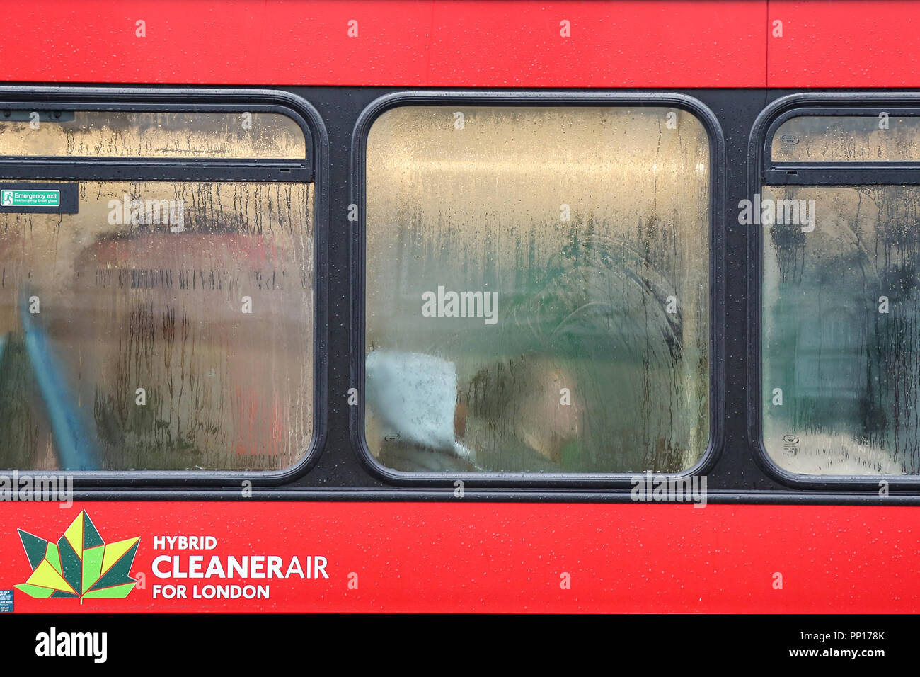 London. UK 23 Sept 2018 - Commuters seen through a steamed bus window ...