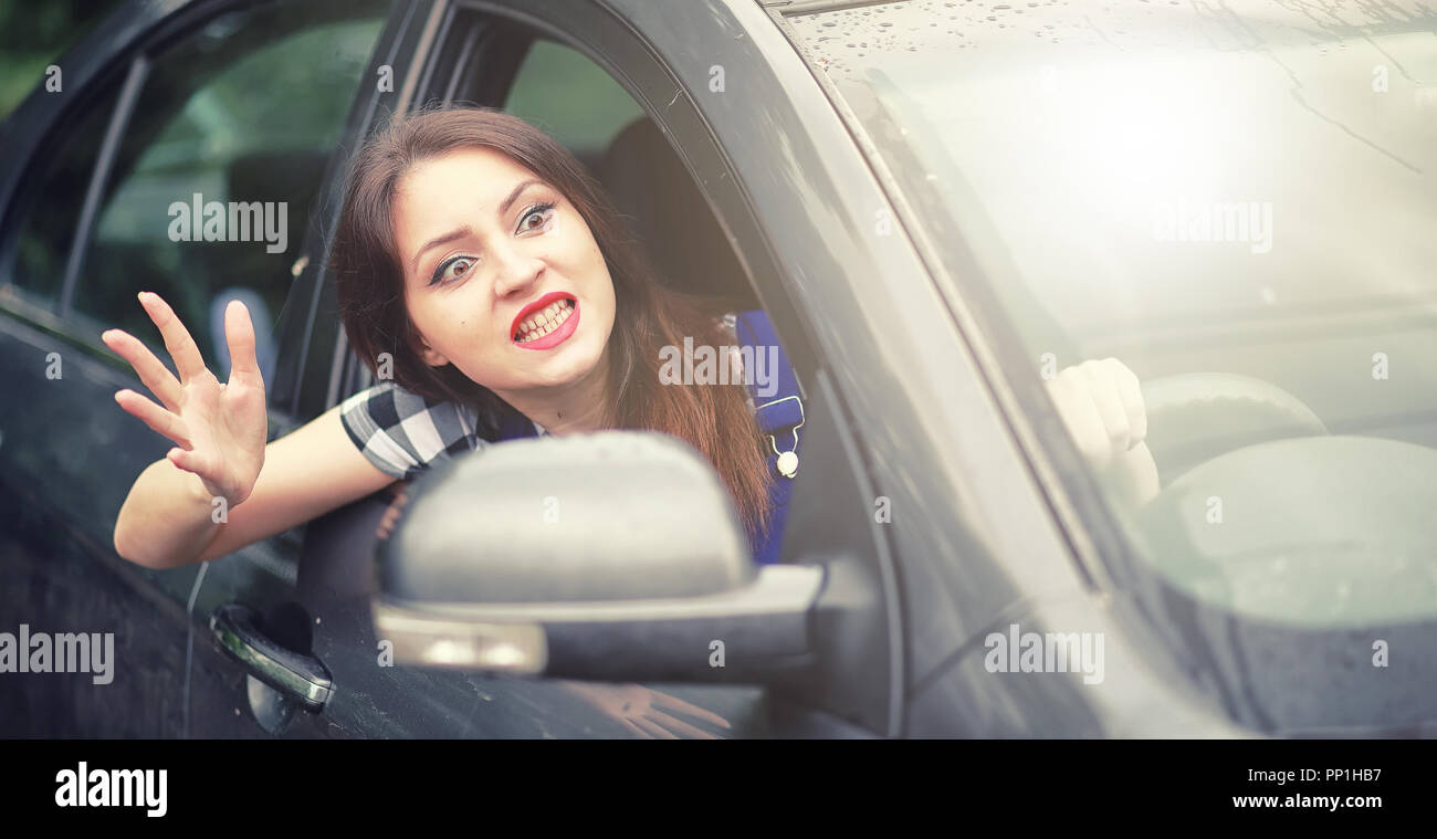 Girl driving a car bad emotions Stock Photo - Alamy