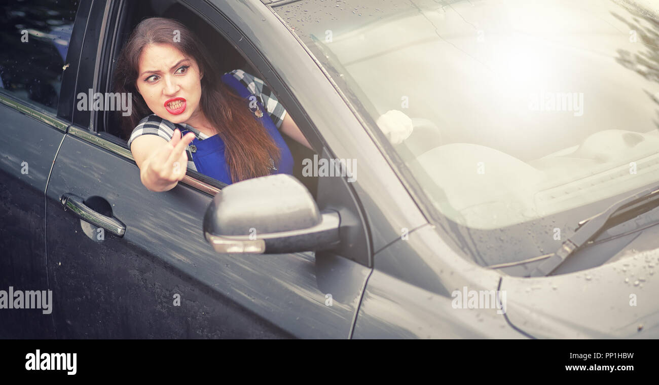 Girl driving a car bad emotions Stock Photo - Alamy