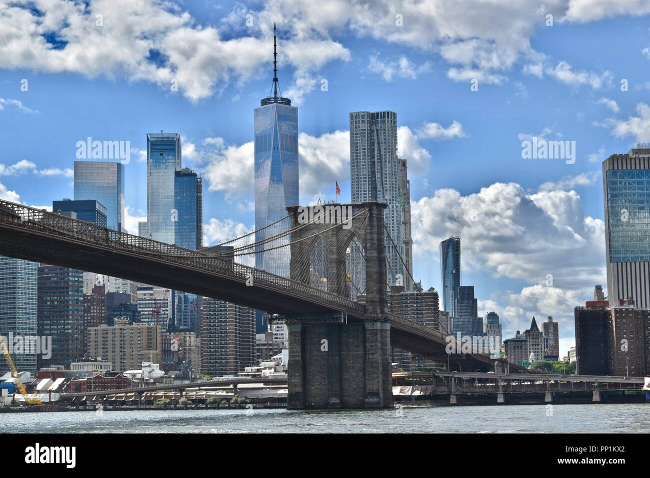 The iconic Brooklyn Bridge spanning the East River between Lower ...
