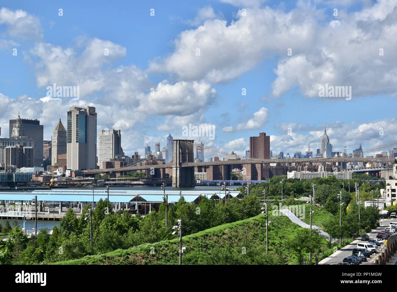 The iconic Brooklyn Bridge spanning the East River between Lower ... The iconic Brooklyn Bridge spanning the East River between Lower ...