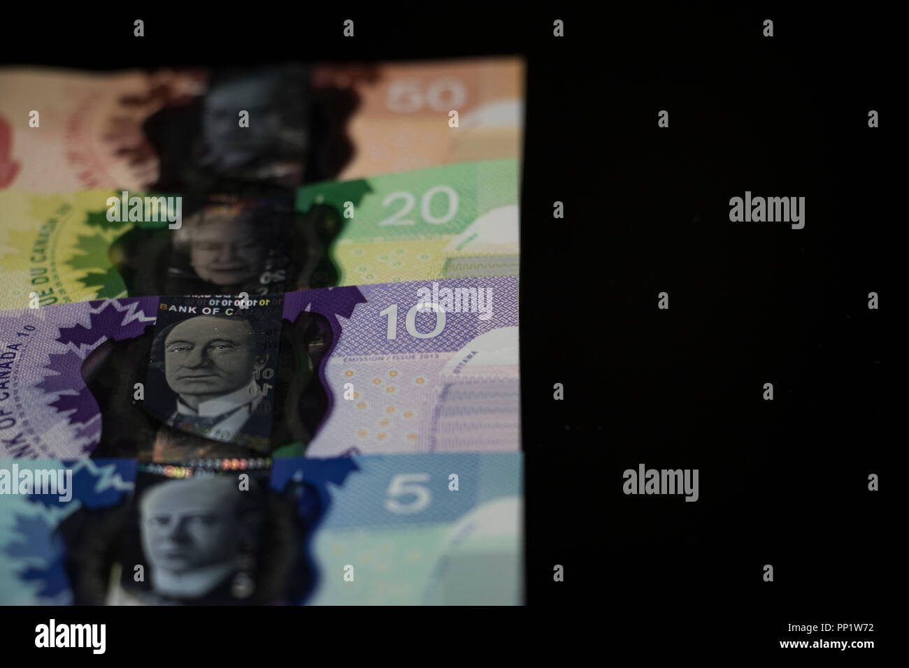 Money laying flat on a table camera pan. Currency of different ...