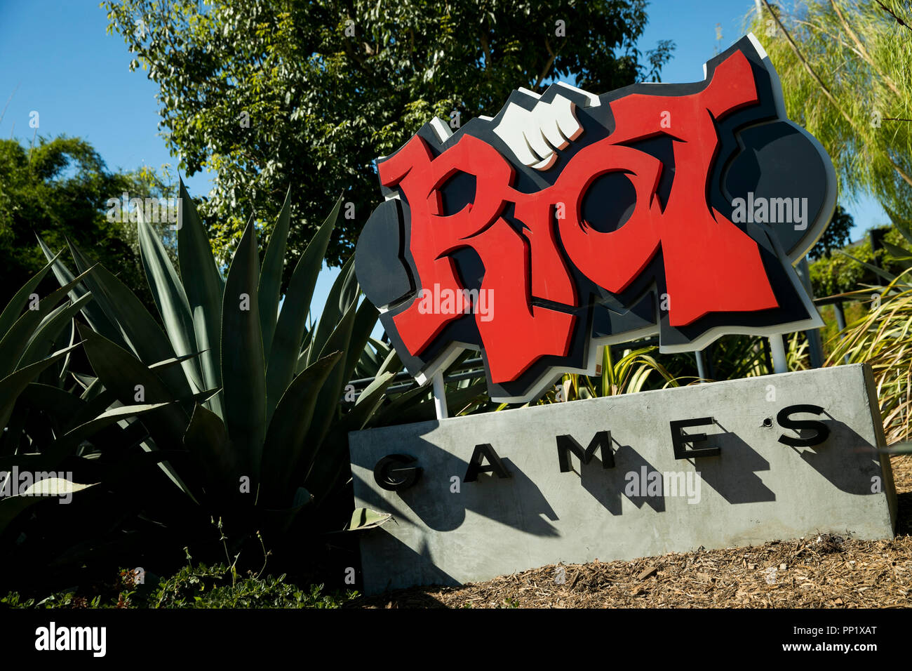 A logo sign outside of the headquarters of Riot Games, Inc., in Los ...