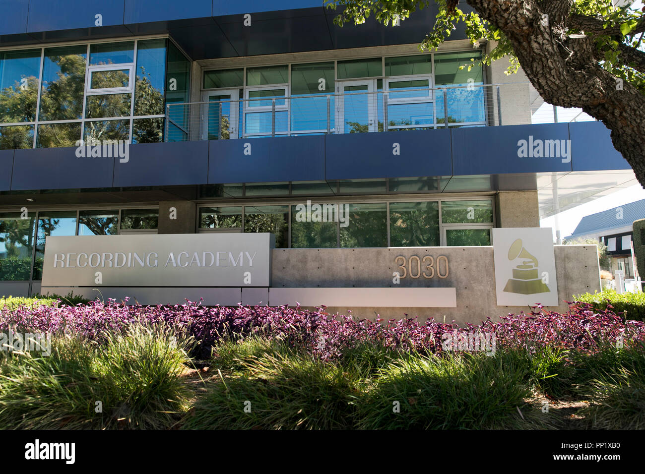 A logo sign outside of the headquarters of The Recording Academy in ...