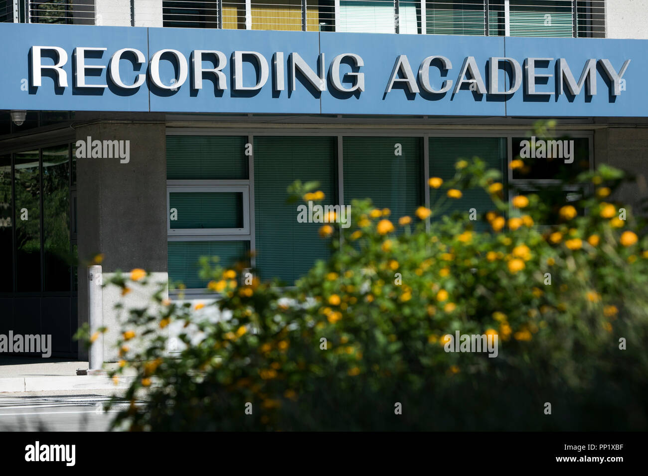 A logo sign outside of the headquarters of The Recording Academy in ...