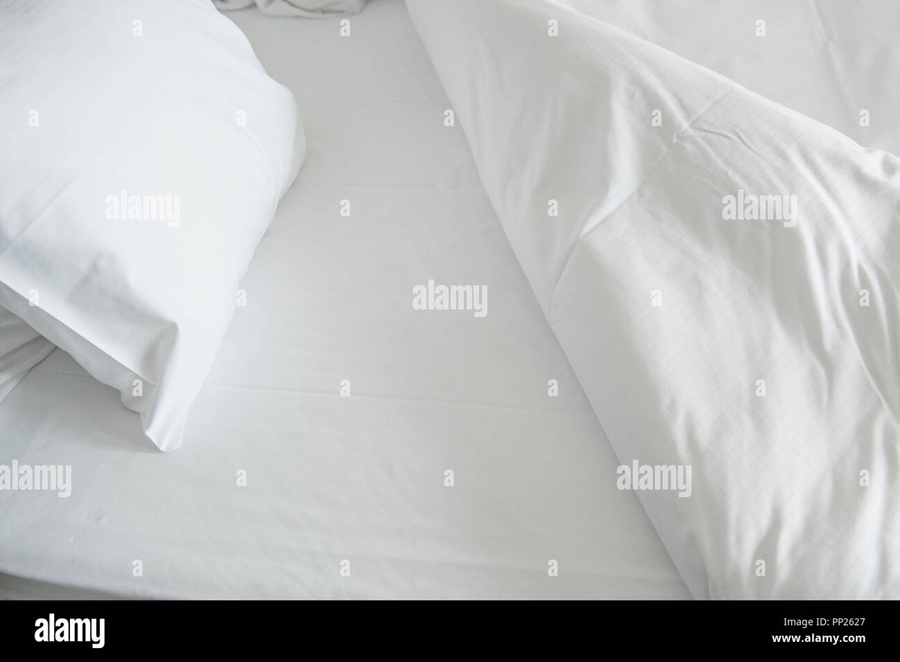 White clean sheets and pillow inviting to go to bed Stock Photo - Alamy