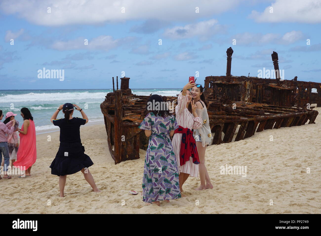 Young Women Taking a Selfie in Front of the SS Maheno Shipwreck Stock ...