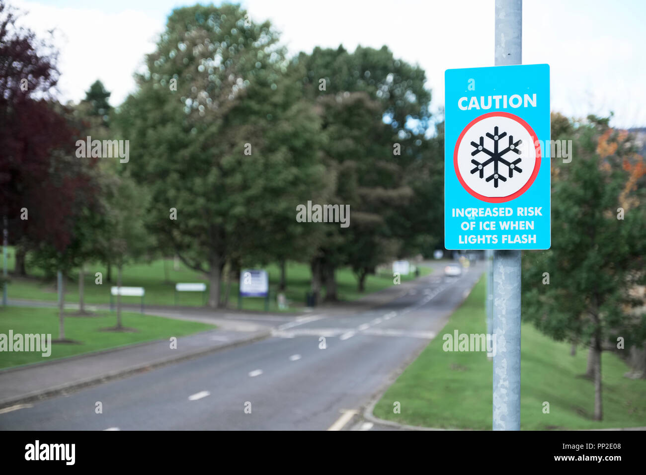 Ice risk road safety sign for winter weather Stock Photo - Alamy