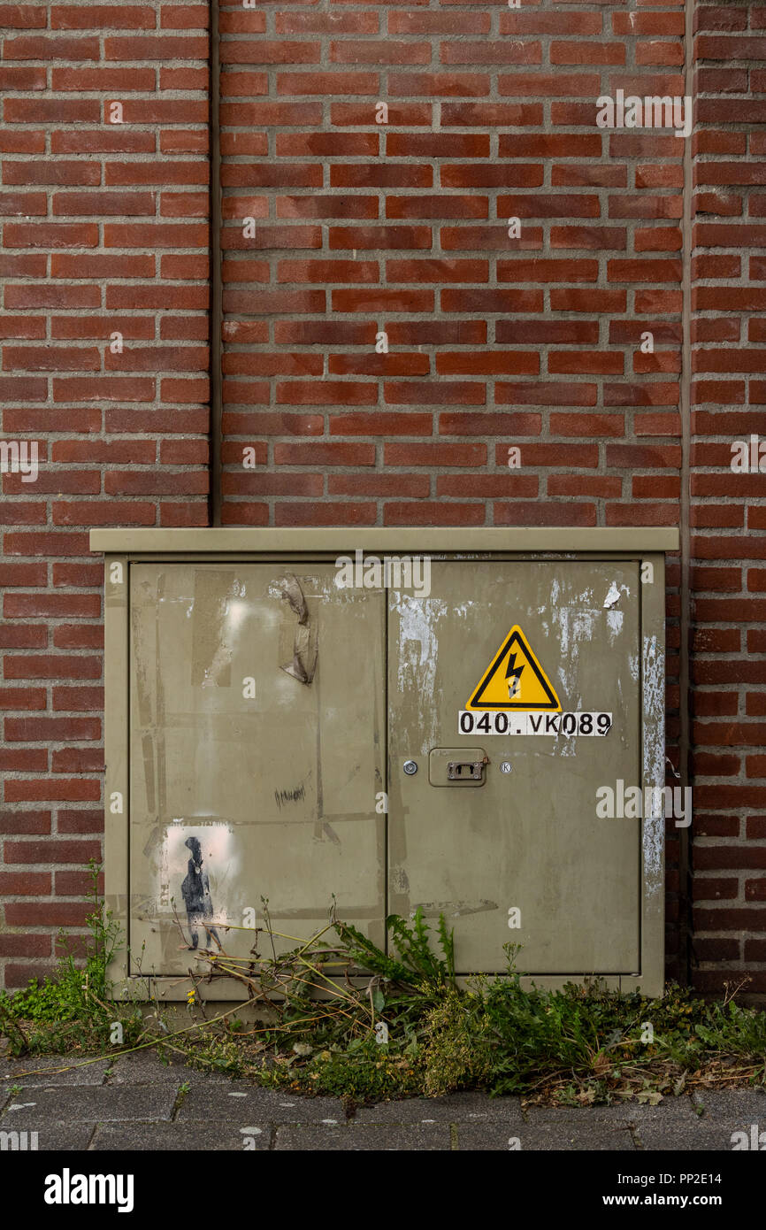 european power relay box with a brick wall background Stock Photo - Alamy