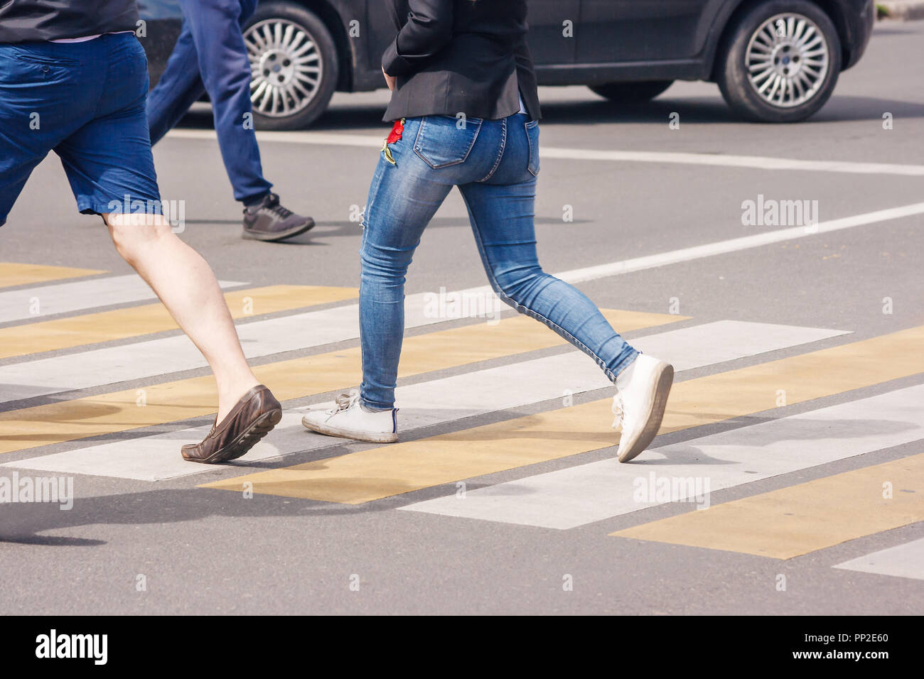 people crossing the pedestrian crossing on sunny summer day Stock Photo ...