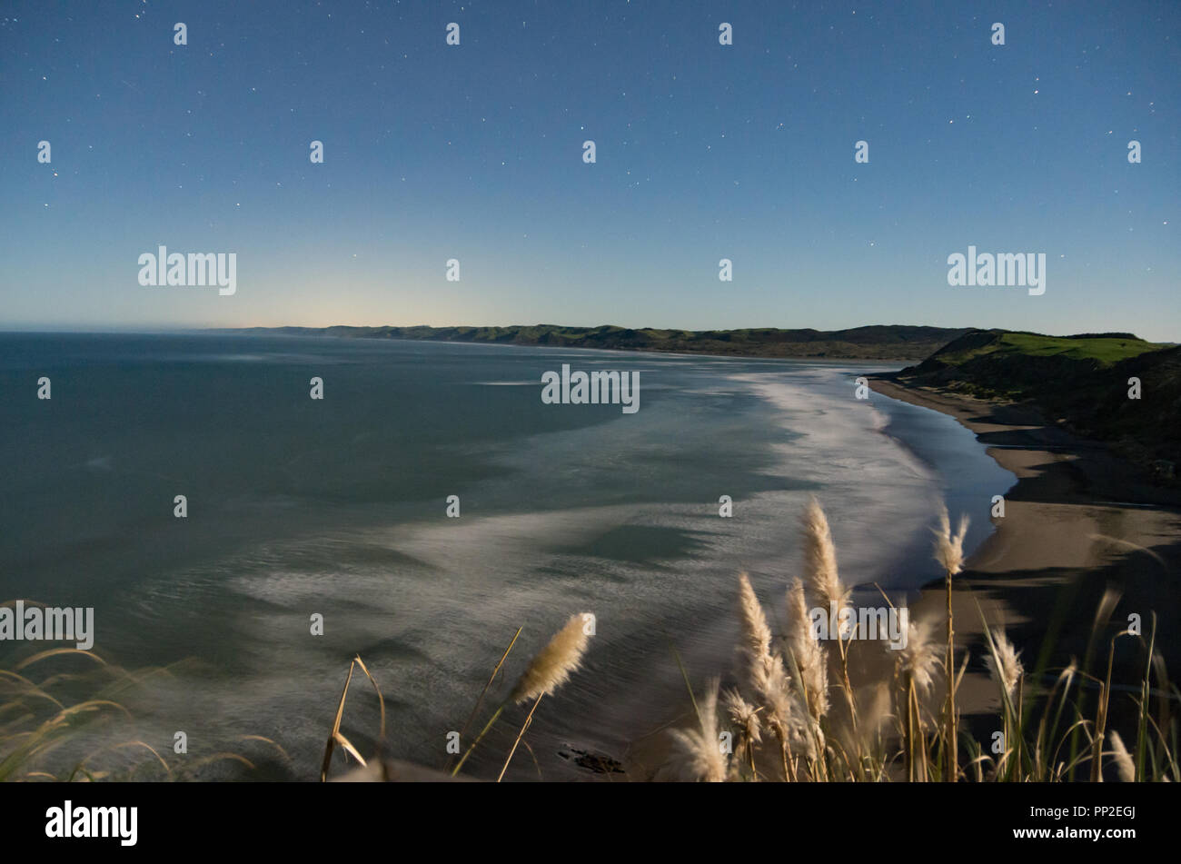 Ngarunui Beach at Night facing towards Raglan lit by the moon Stock ...