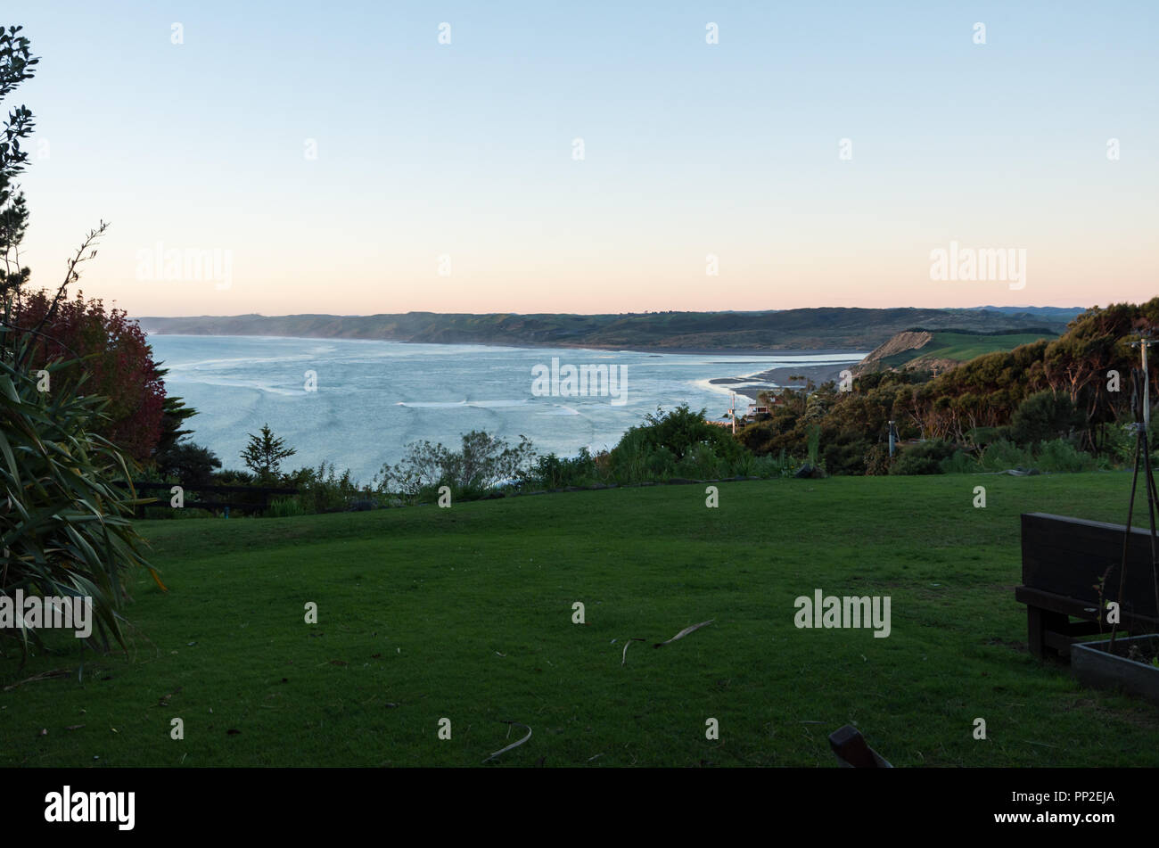 Ngarunui Beach as seen from the cliff side in the afternoon Stock Photo ...