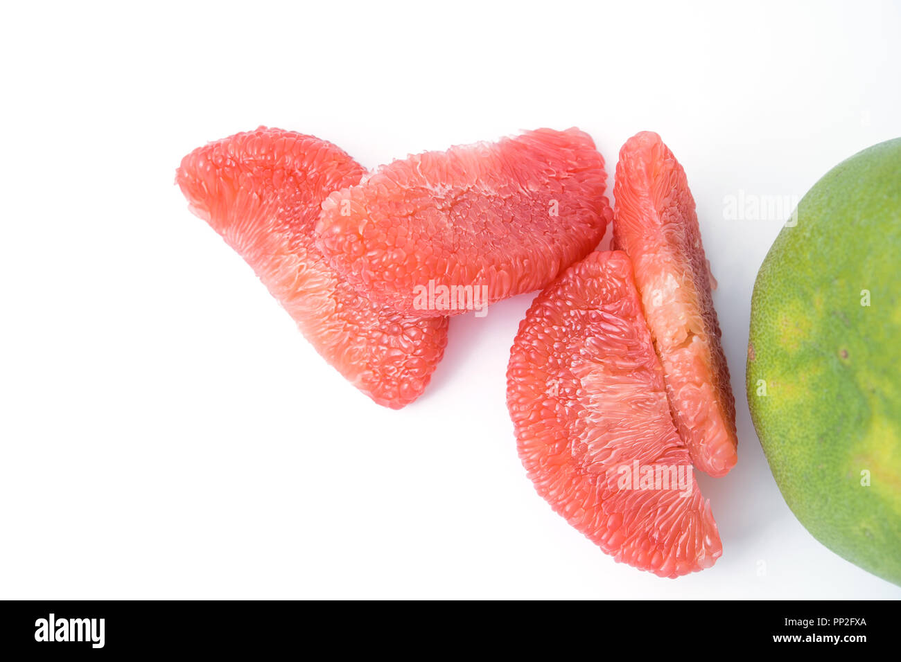 red pomelo pulp fruit isolated on white background Stock Photo - Alamy