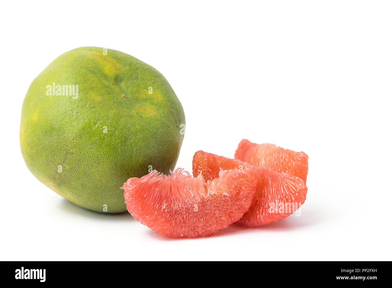 red pomelo pulp fruit isolated on white background Stock Photo - Alamy