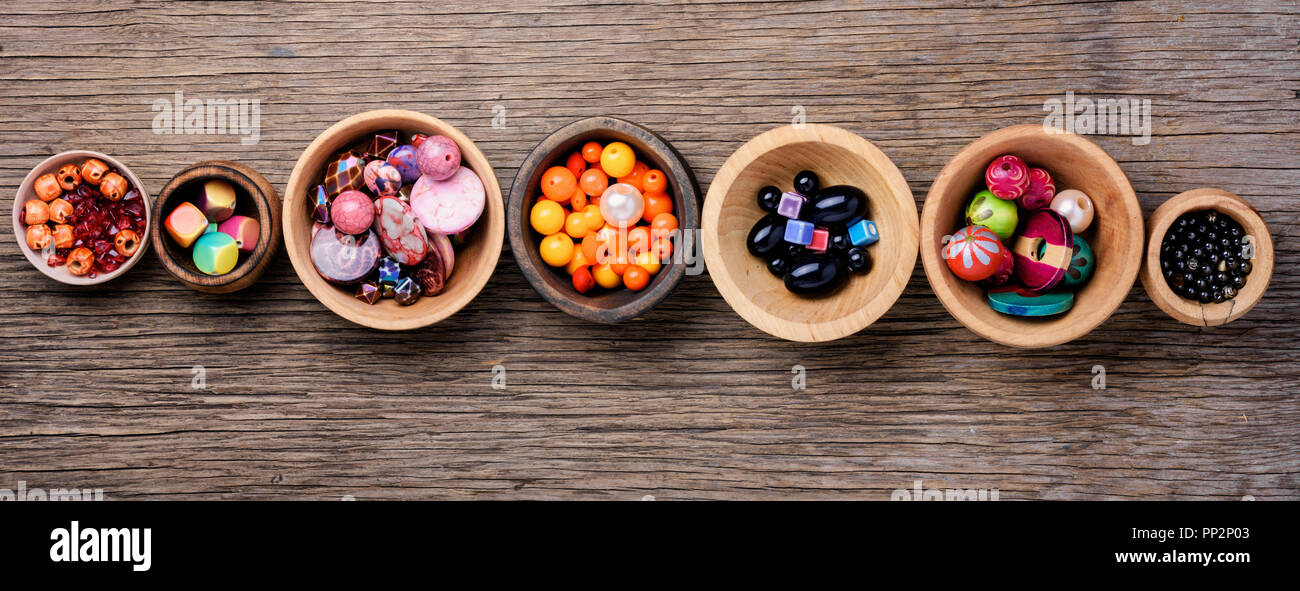 Variety of shapes and colors beads to make a bead necklace.Handcraft ...