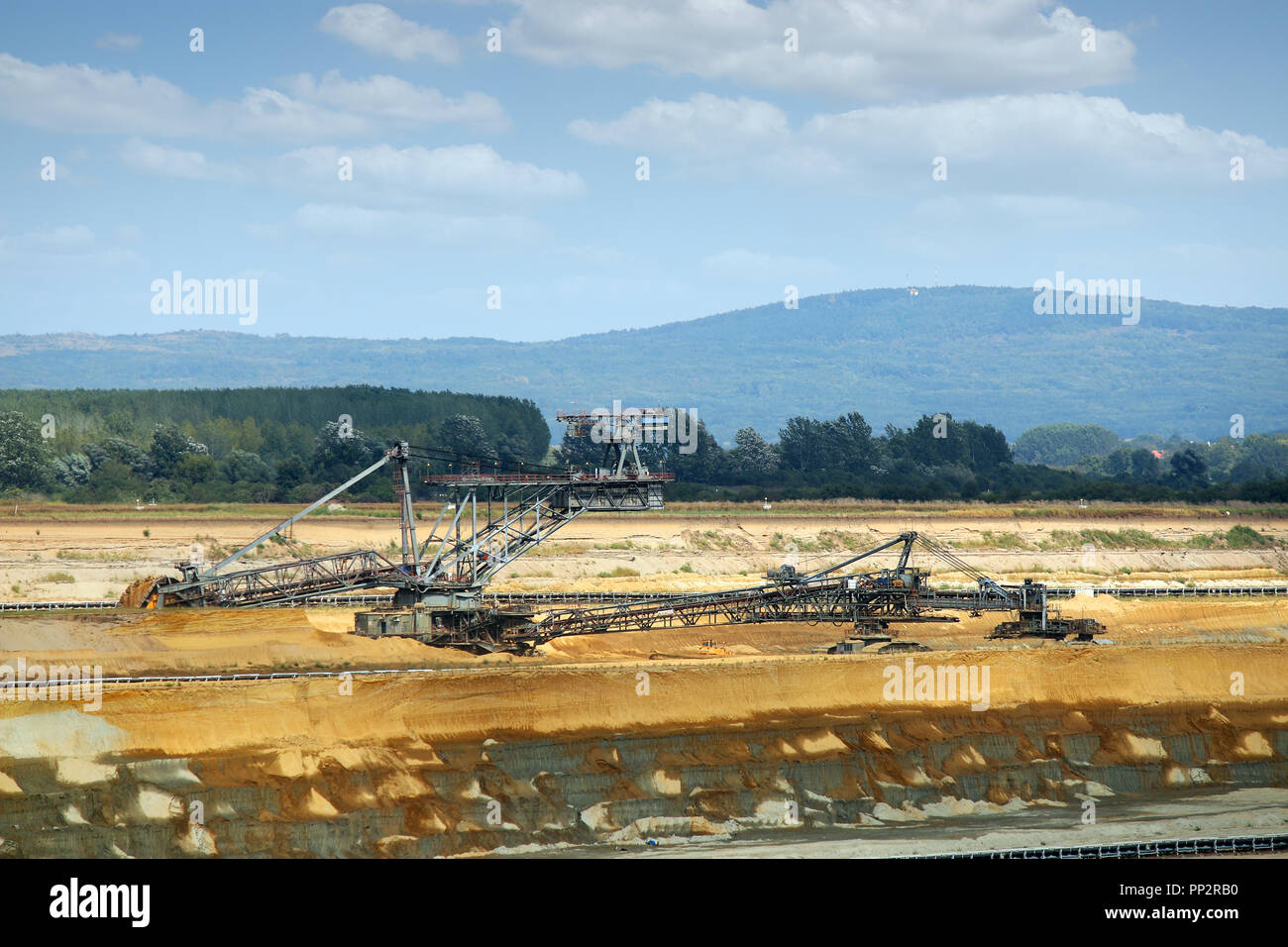 a large excavator digging coal open pit coal mine Stock Photo - Alamy