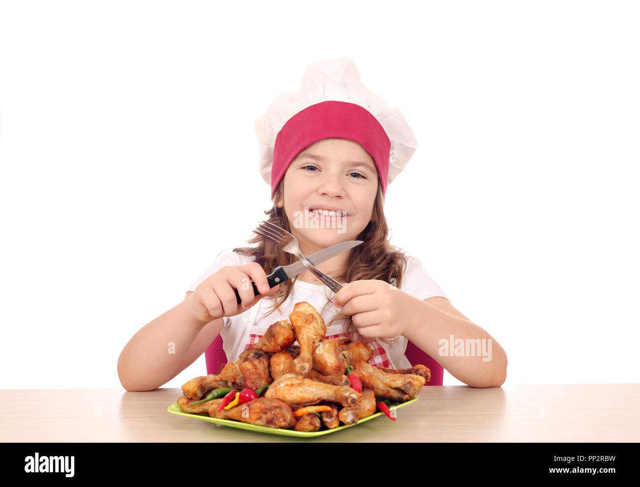 happy little girl cook with chicken drumstick Stock Photo - Alamy