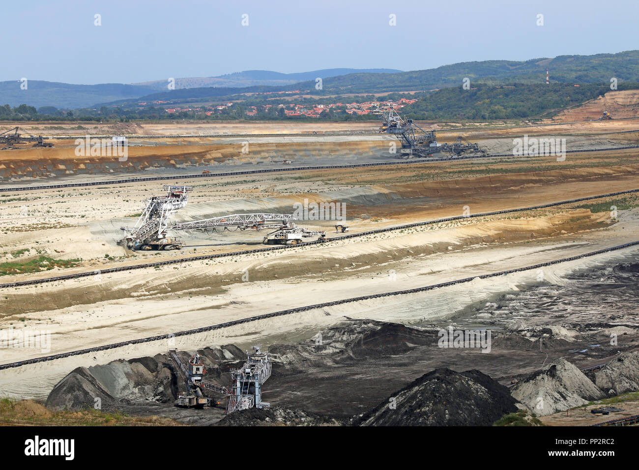 large excavators digging coal open pit coal mine Stock Photo - Alamy