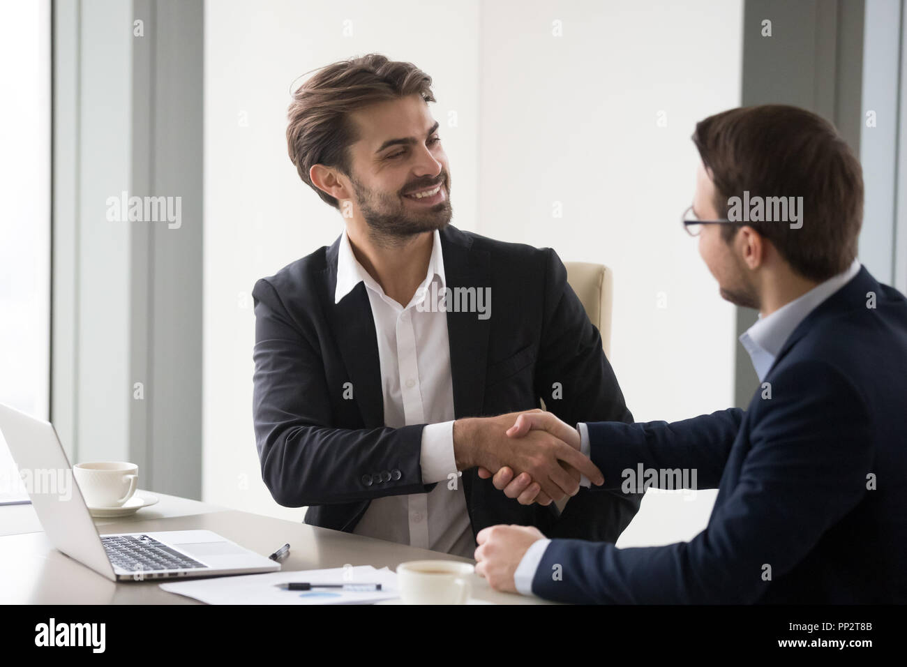 Happy business partners hi-res stock photography and images - Alamy