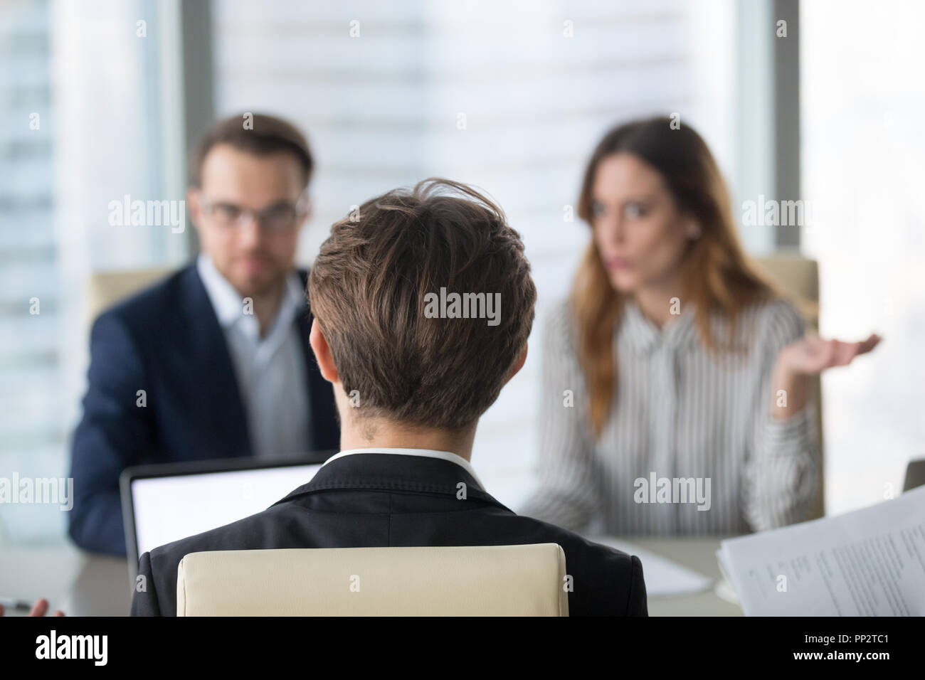 Back view of male CEO negotiating with diverse partners Stock Photo - Alamy