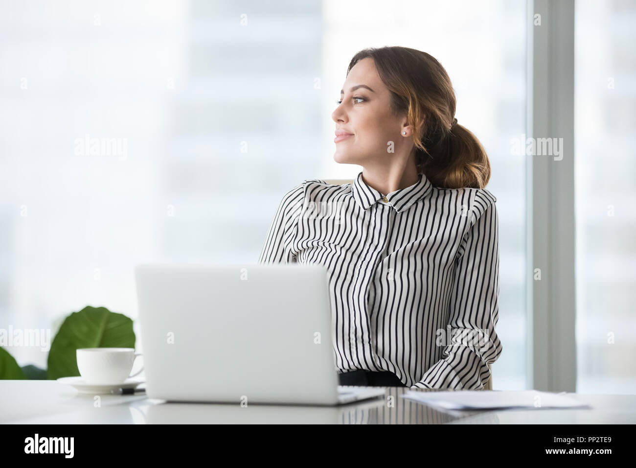 Smiling while thinking hi-res stock photography and images - Alamy