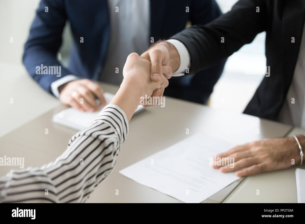 Close up of HR handshaking female job applicant at interview Stock ...