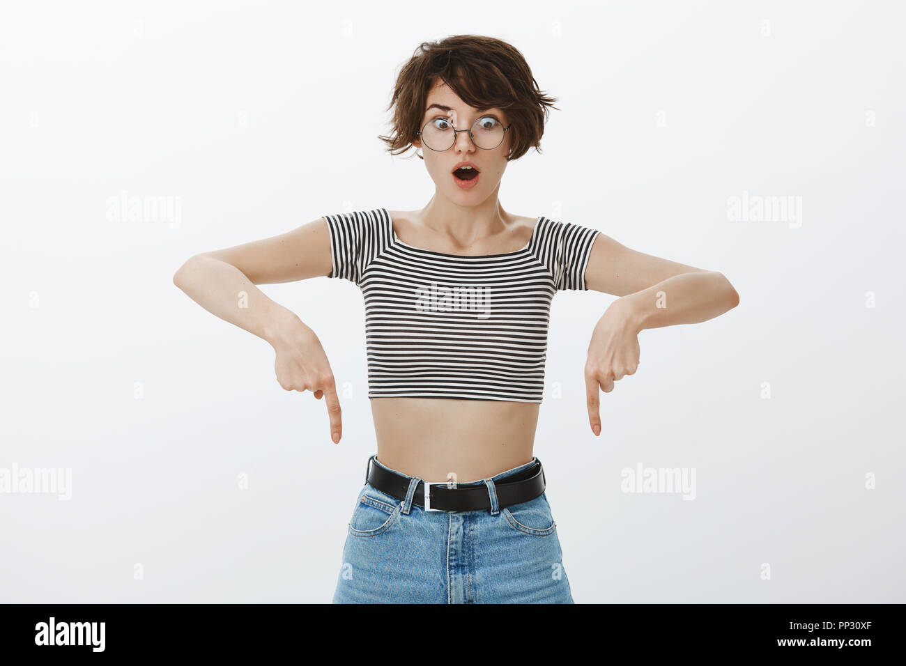 Omg, look down it is fantastic. Portrait of shocked and stunned girl in ...
