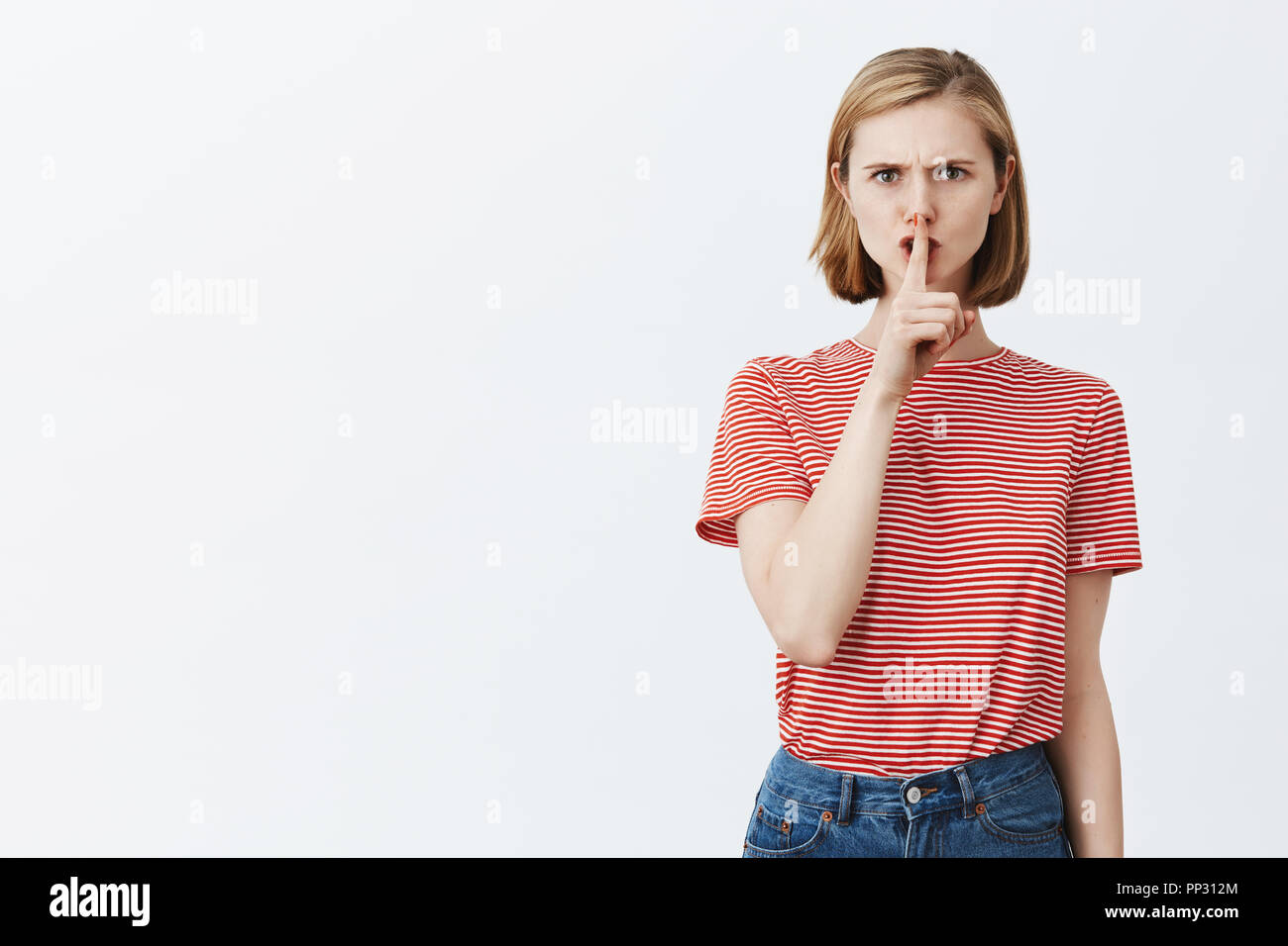 I demand to shut up. Angry and displeased strict elder sister with ...