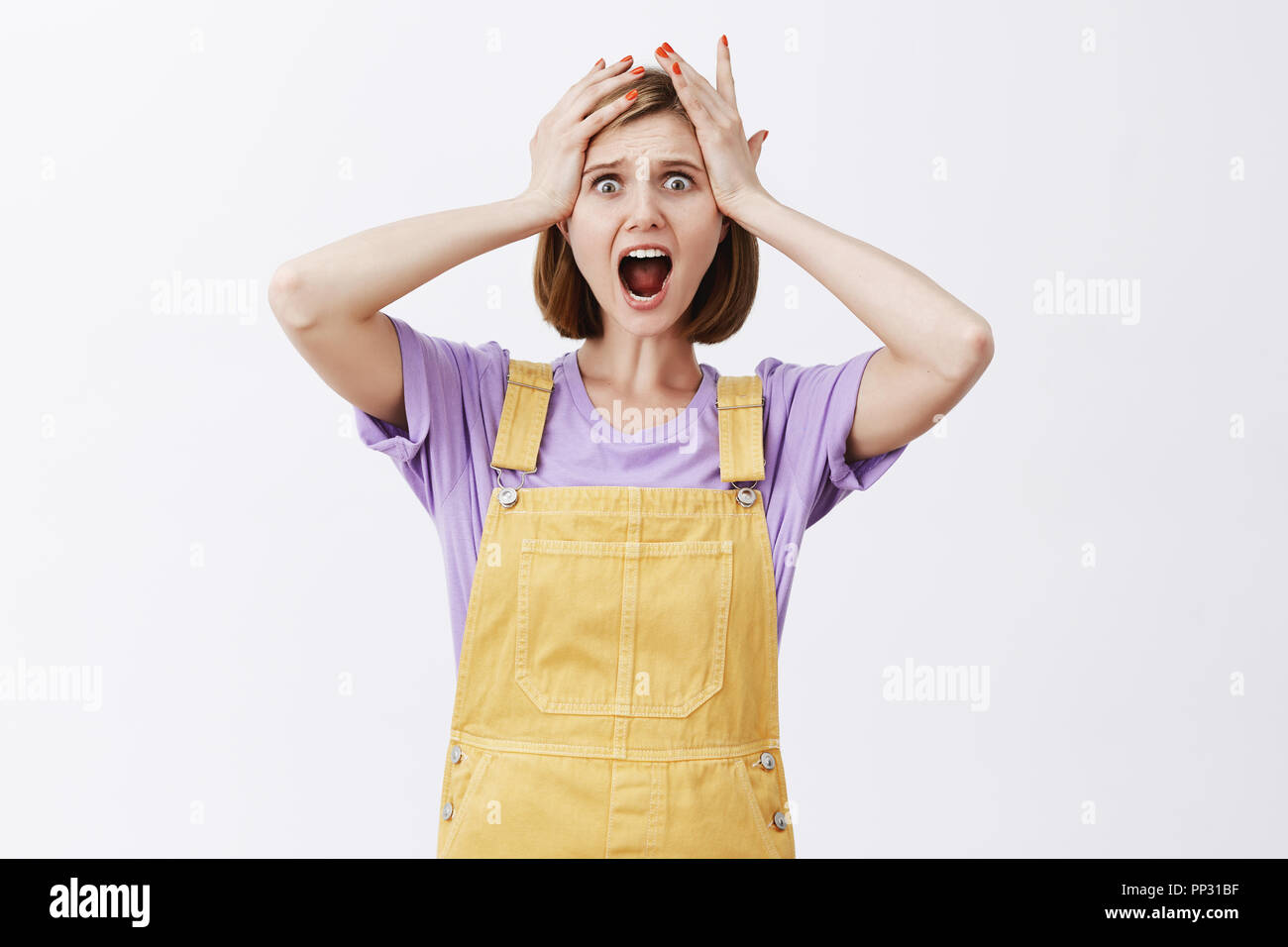 Gosh what have you done. Portrait of shocked and displeased upset woman ...