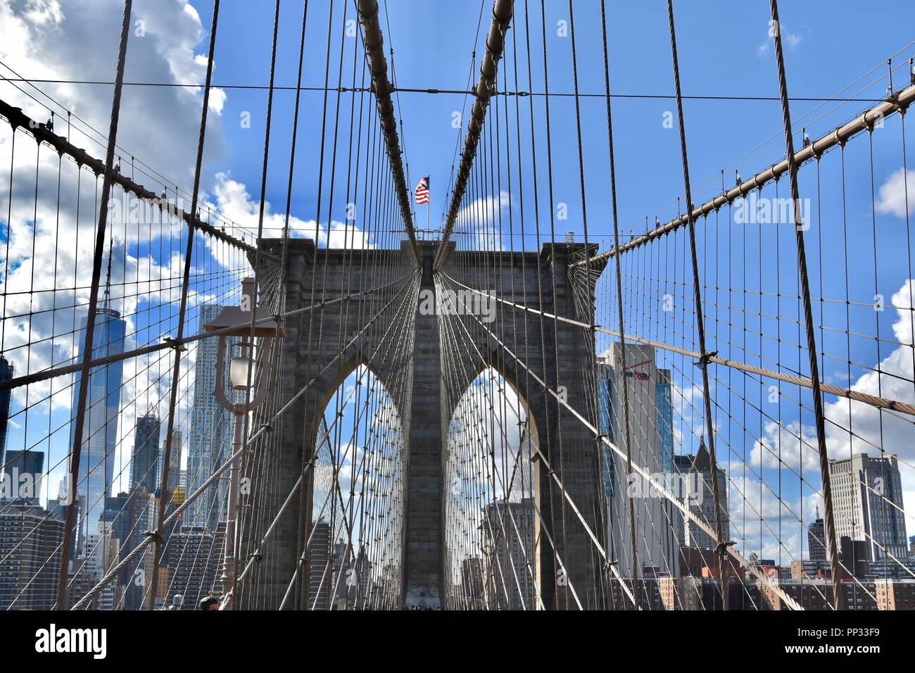 The iconic Brooklyn Bridge spanning the East River between Lower ... The iconic Brooklyn Bridge spanning the East River between Lower ...