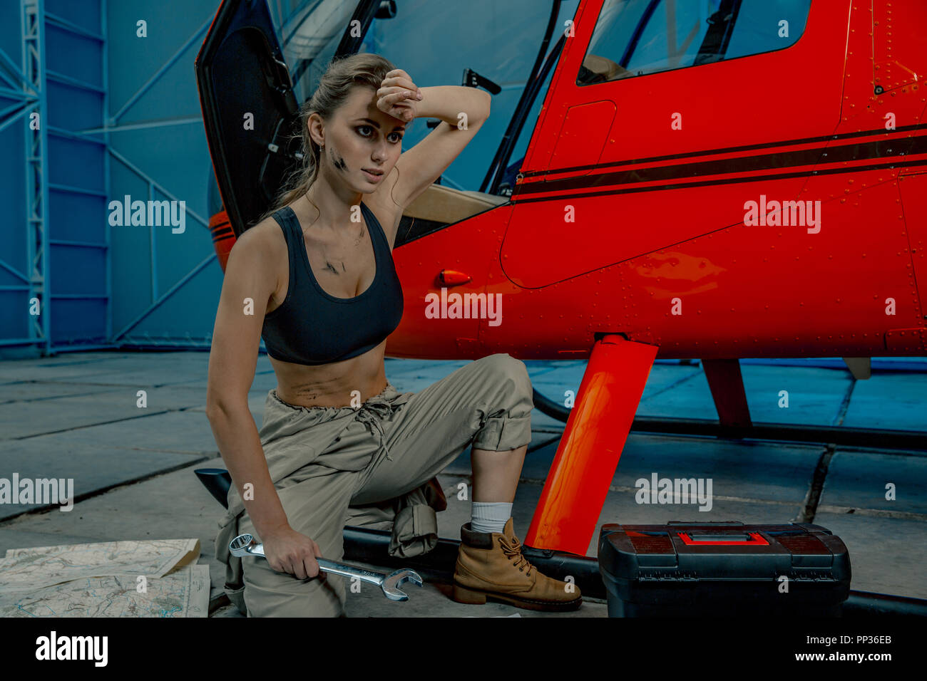 helicopter maintenance femail worker. woman pilot or helicopter ...