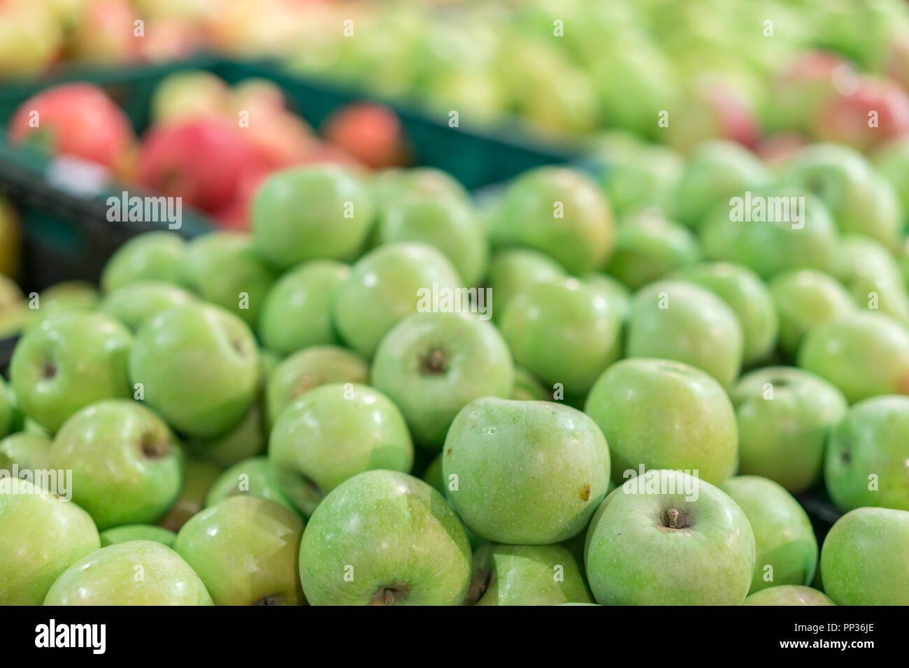Green apples in a box in the store. green apples in boxes on market ...